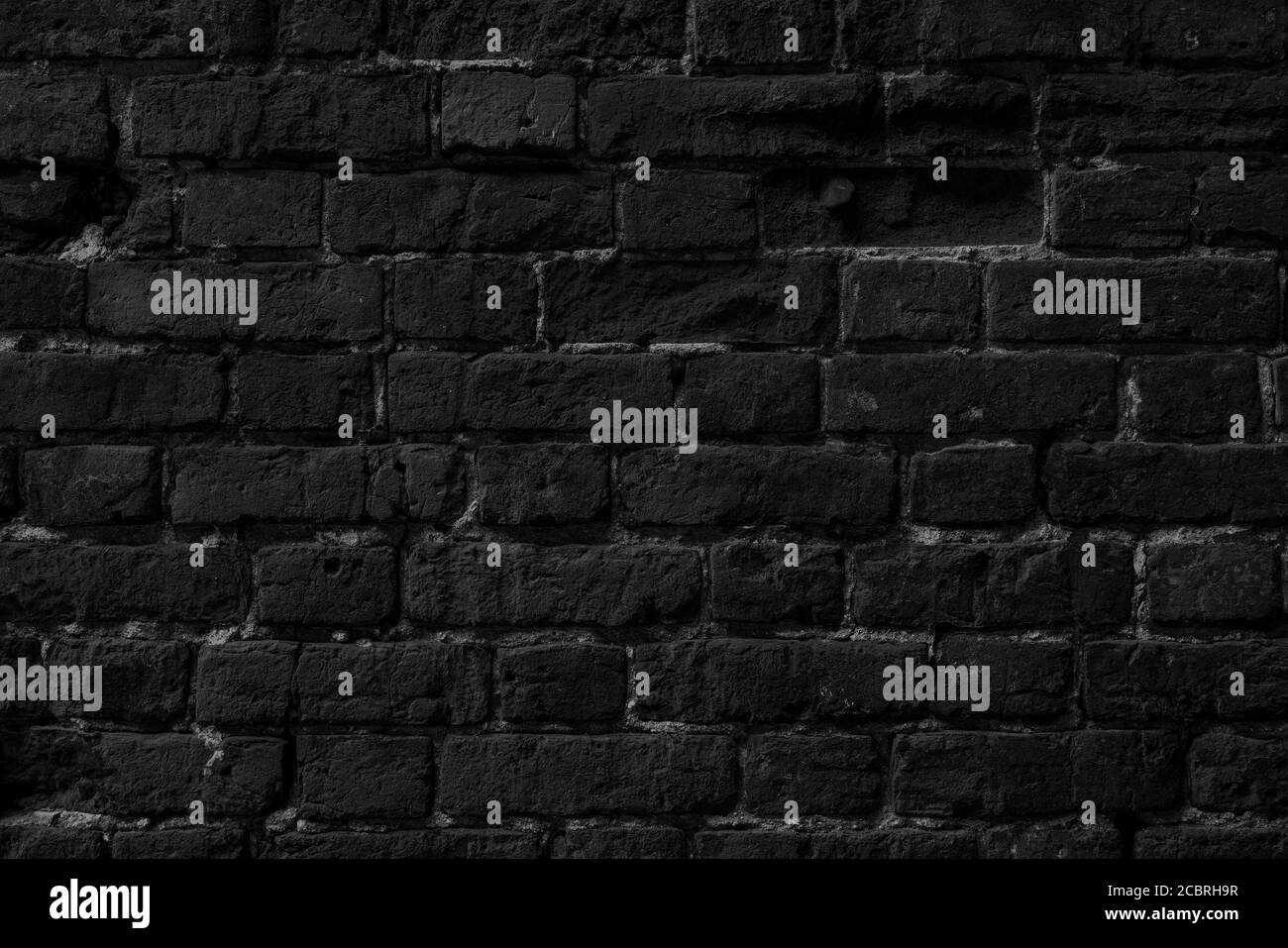 Black brick building wall. Interior of a modern loft. Background for ...