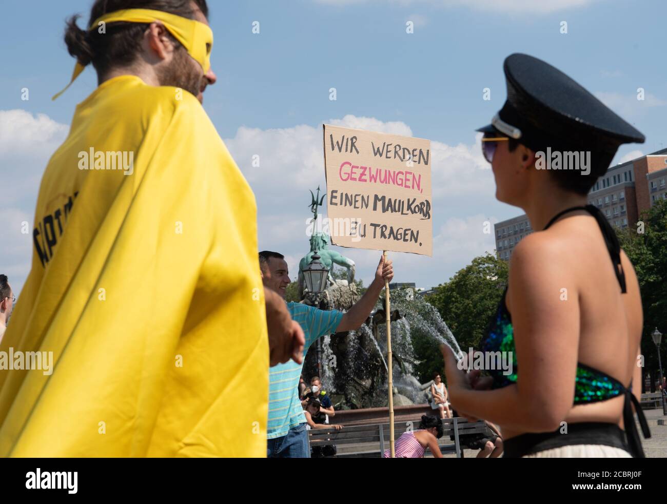 15 August 2020, Berlin: A participant in the "10th Freedom Parade ...