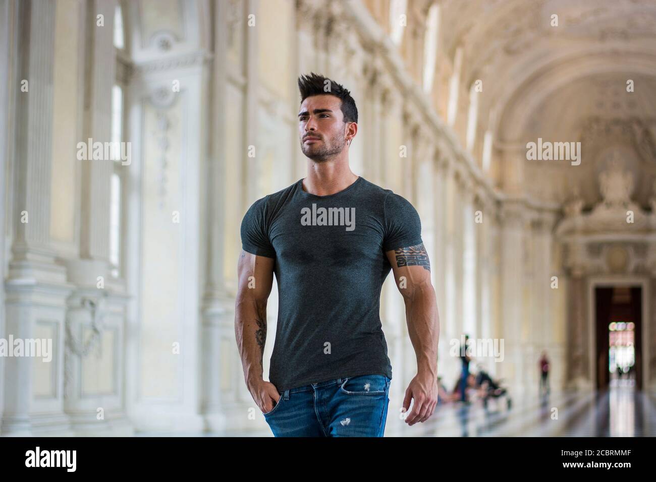 Handsome Man Looking Around Inside a Museum Stock Photo - Alamy