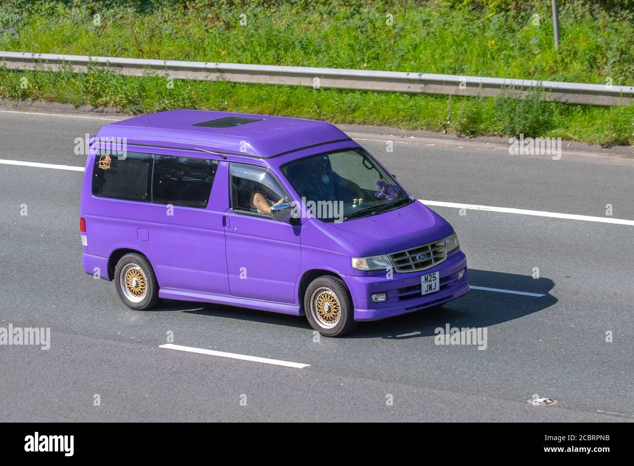 1997 Mauve purple Mazda LCV van; Vehicular traffic moving vehicles ...