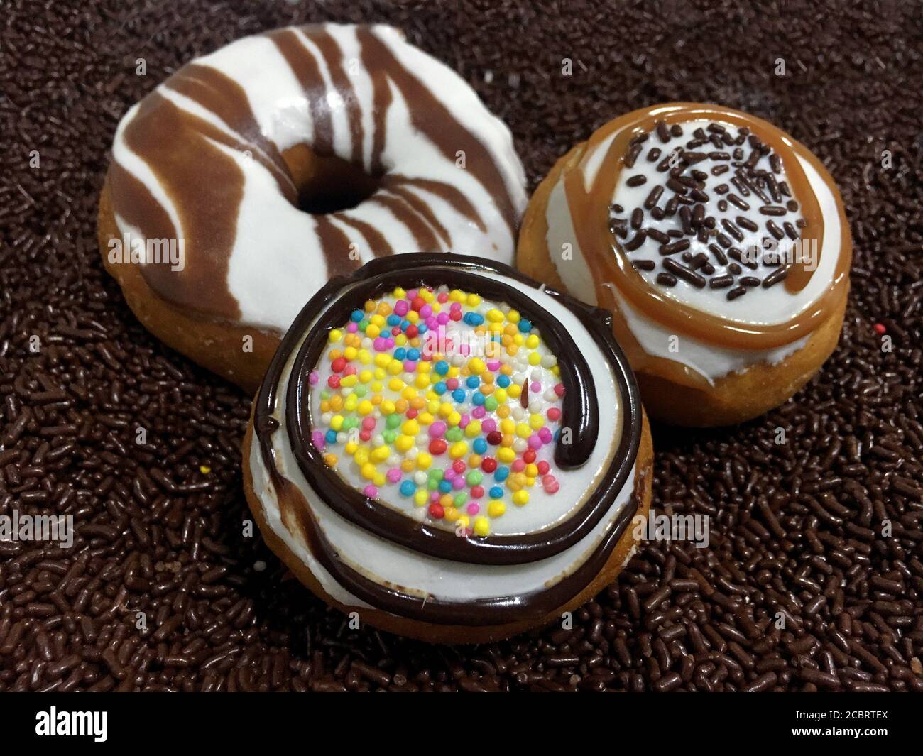 Delicious Colored Donuts Stock Photo - Alamy