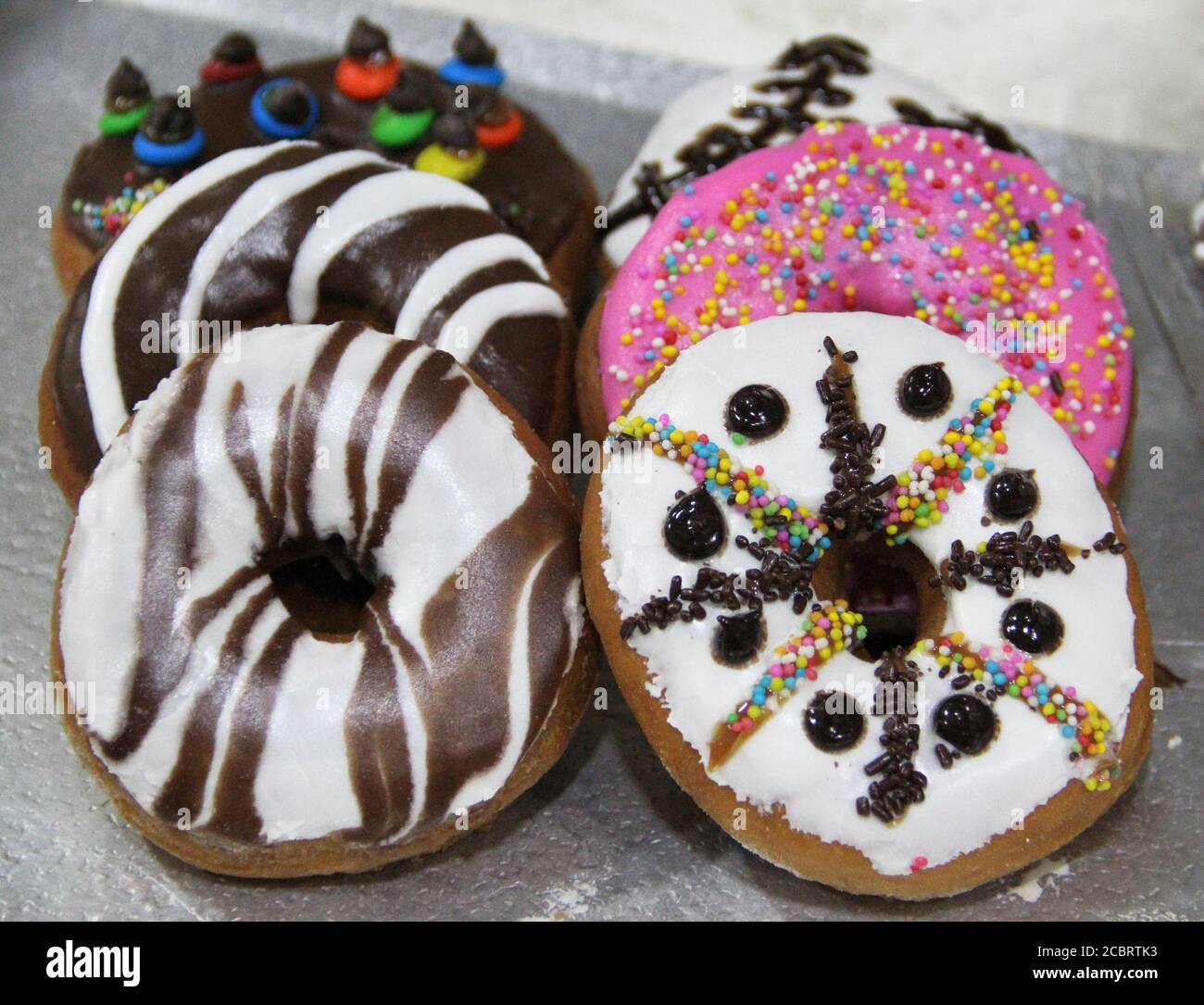 Delicious Colored Donuts Stock Photo - Alamy