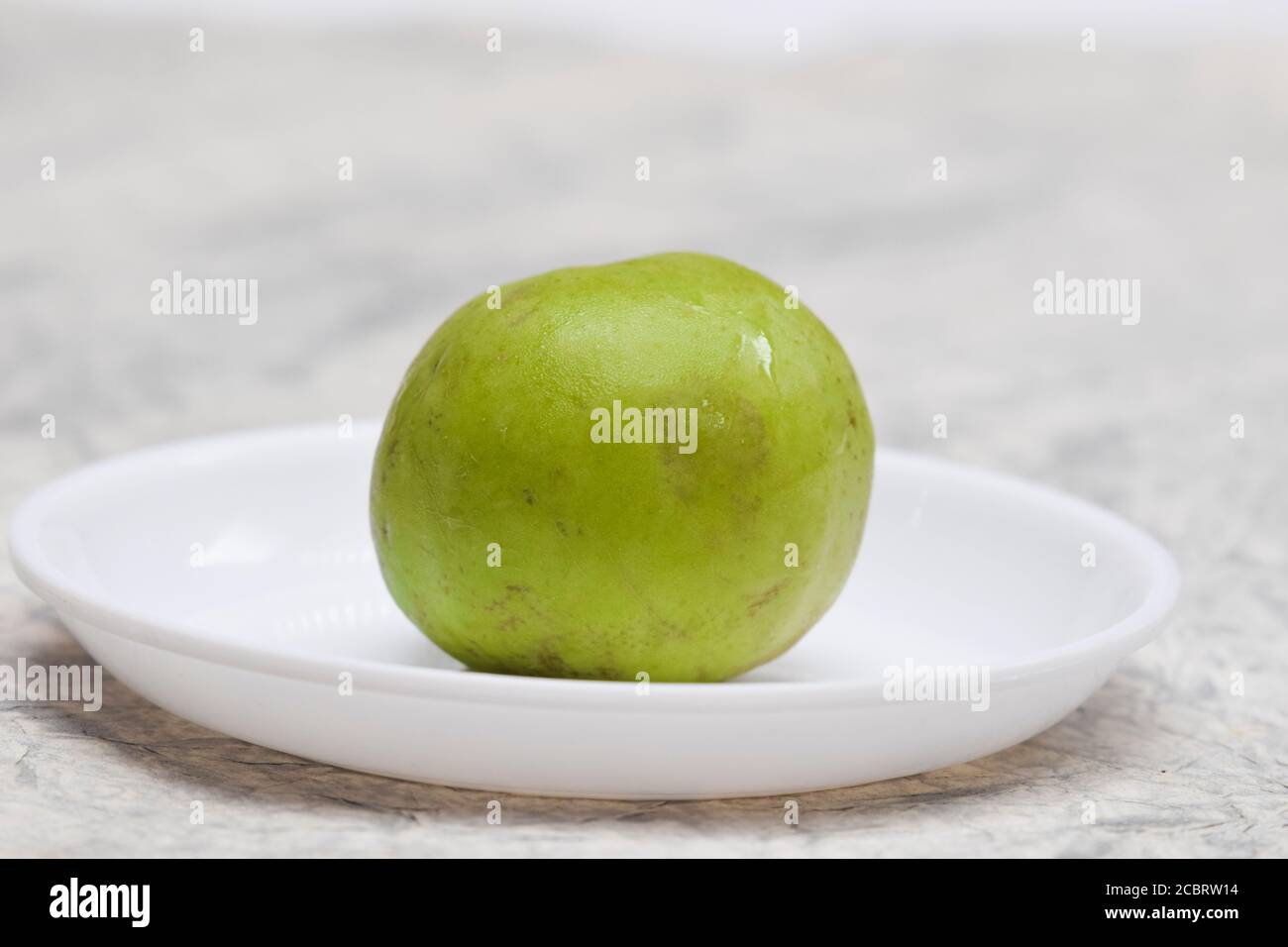 Single small Indian squash or apple gourd isolate on white background ...