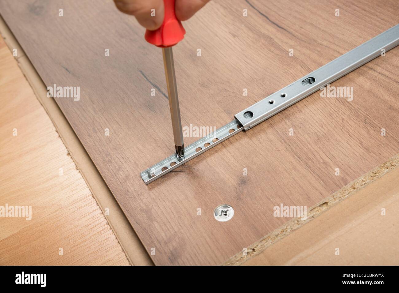 Putting together self assembly furniture.Diy concept Stock Photo - Alamy