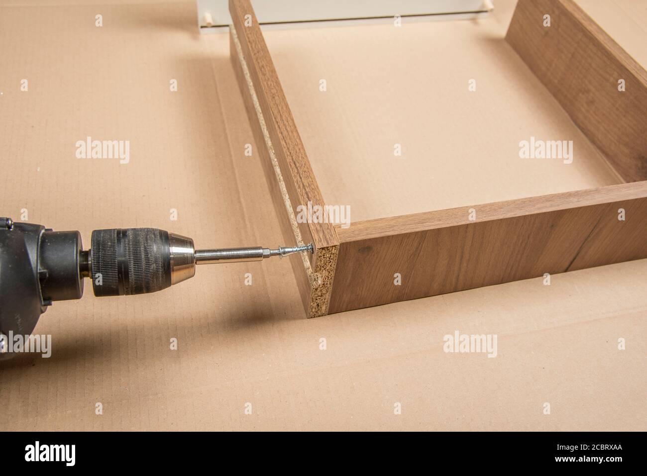 Putting together self assembly furniture.Diy concept Stock Photo - Alamy