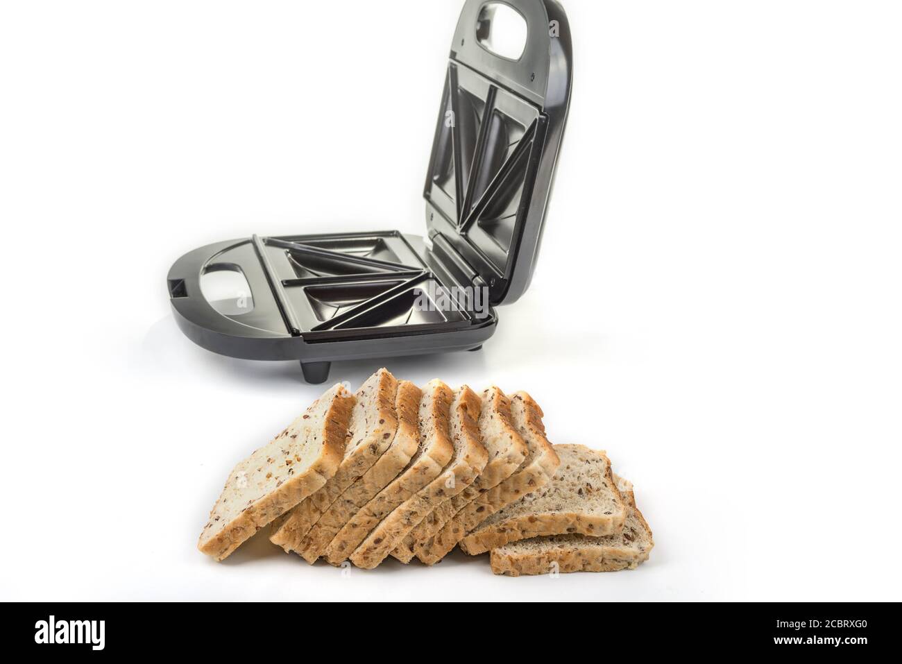 Slice sandwich toaster on a white background Stock Photo - Alamy