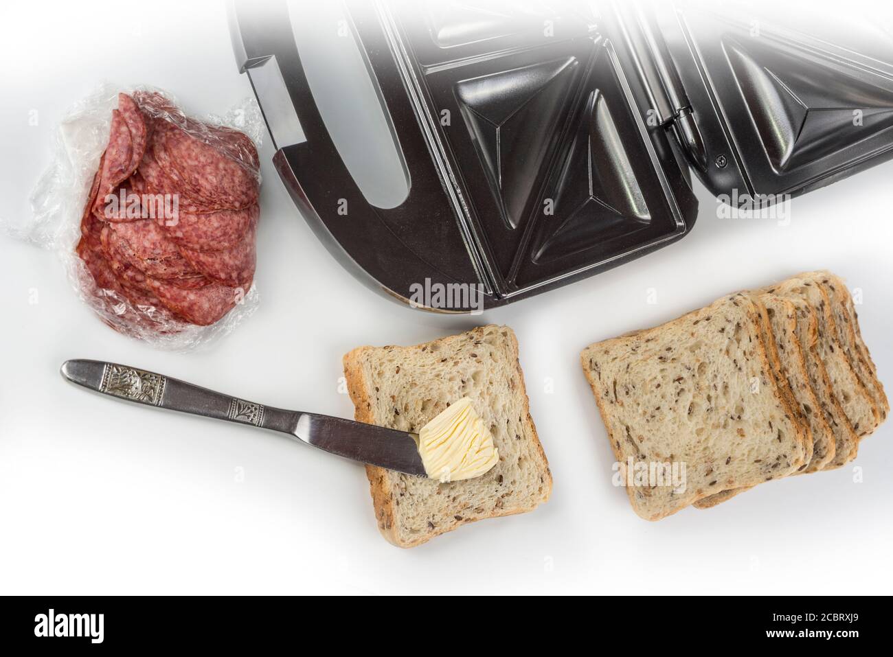 Slice sandwich toaster on a white background Stock Photo - Alamy