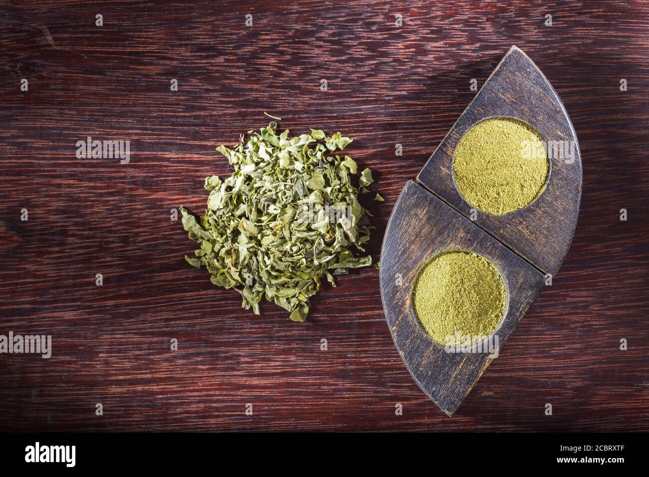 dried leaves and moringa powder on the table, Moringa oleifera Stock ...