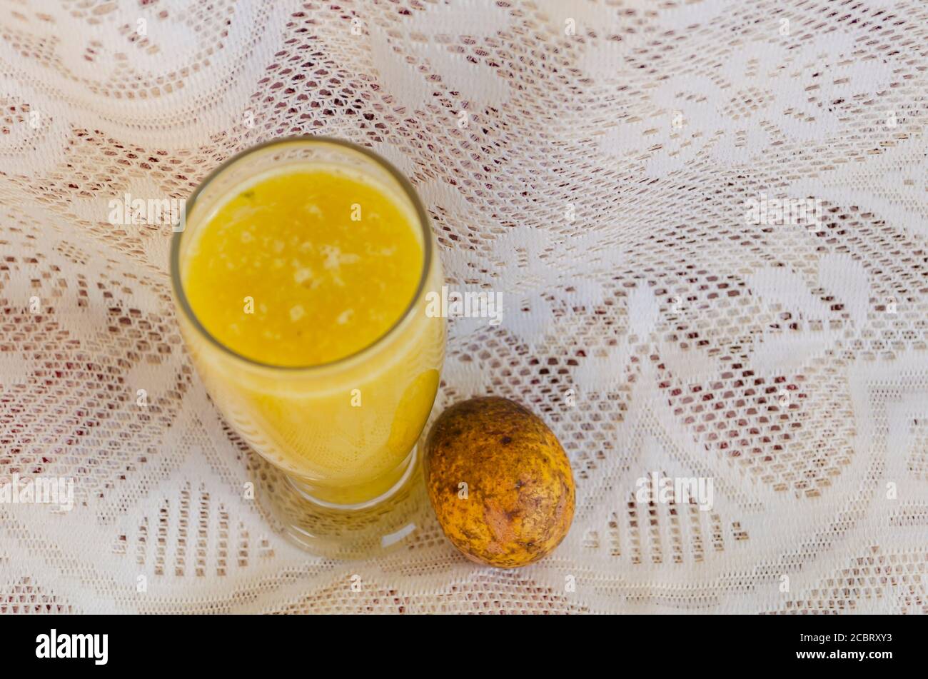 Glass Of June Plum Juice and Fruit Stock Photo - Alamy