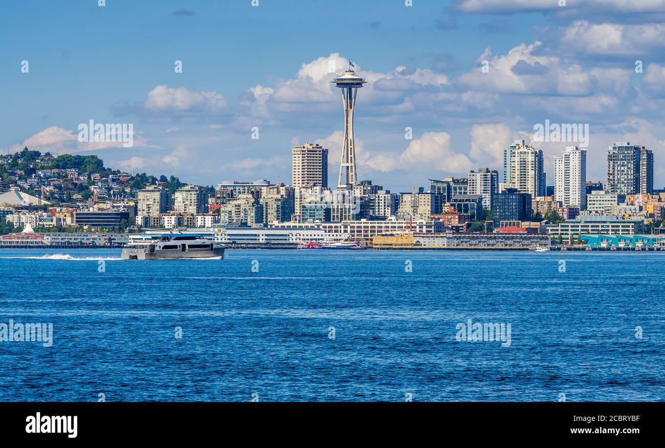 A water taxi cruises toware the skyline in Seattle, Washington Stock ...