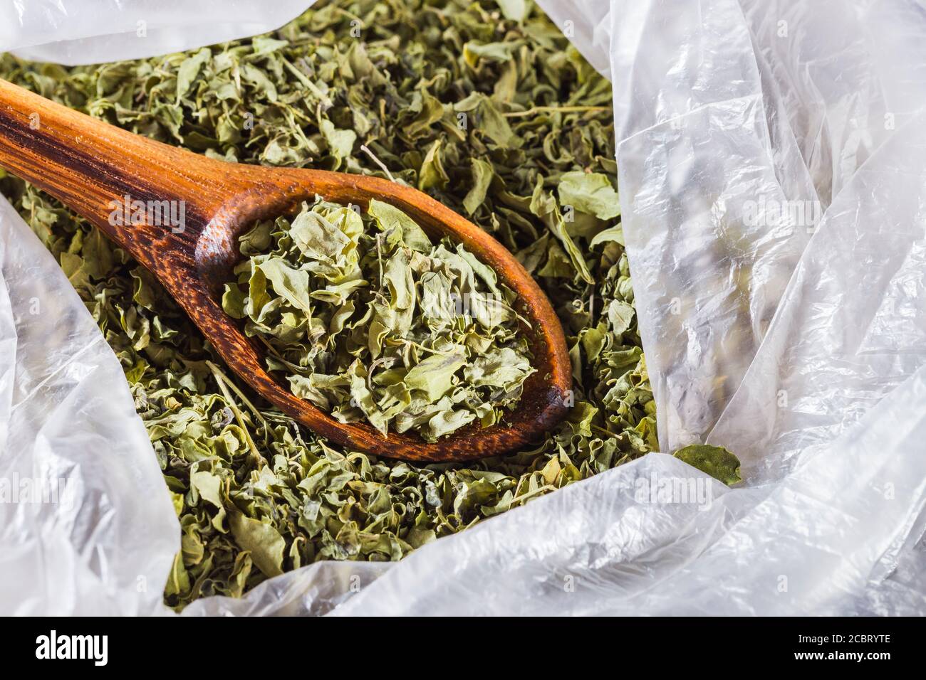 dried moringa leaves in bowl on the table, Moringa oleifera Stock Photo ...