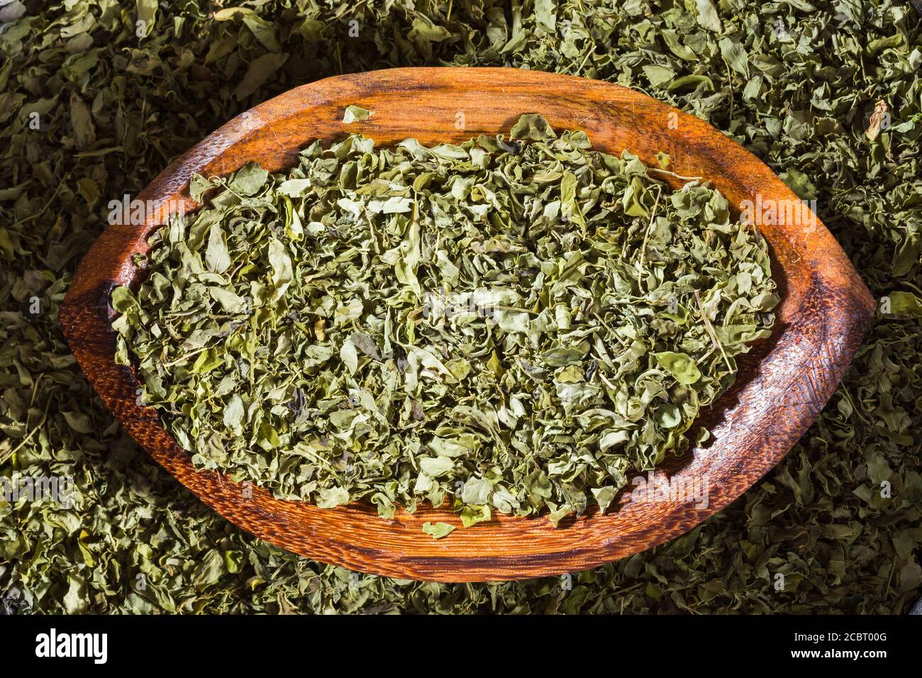 dried moringa leaves in bowl on the table, Moringa oleifera Stock Photo ...