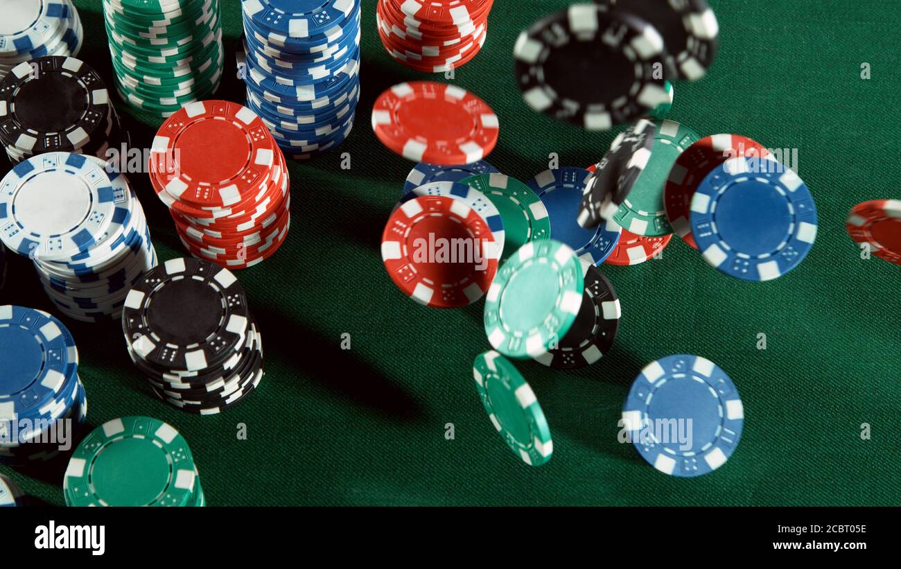 Poker still life with falling poker chips . Concept of hazard gaming ...