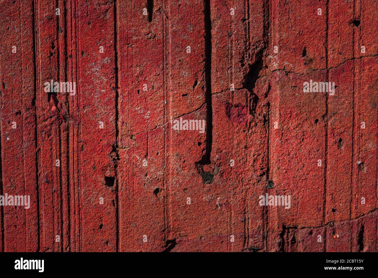 texture of red brick with cracks and potholes close-up stone background ...