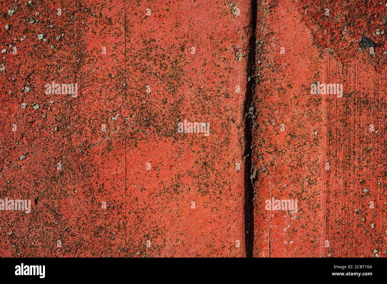 bright red brick texture with a crack close-up industrial background ...