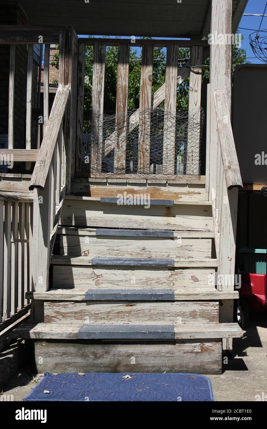 Stairs leading to the back porch of an average middle class home in ...