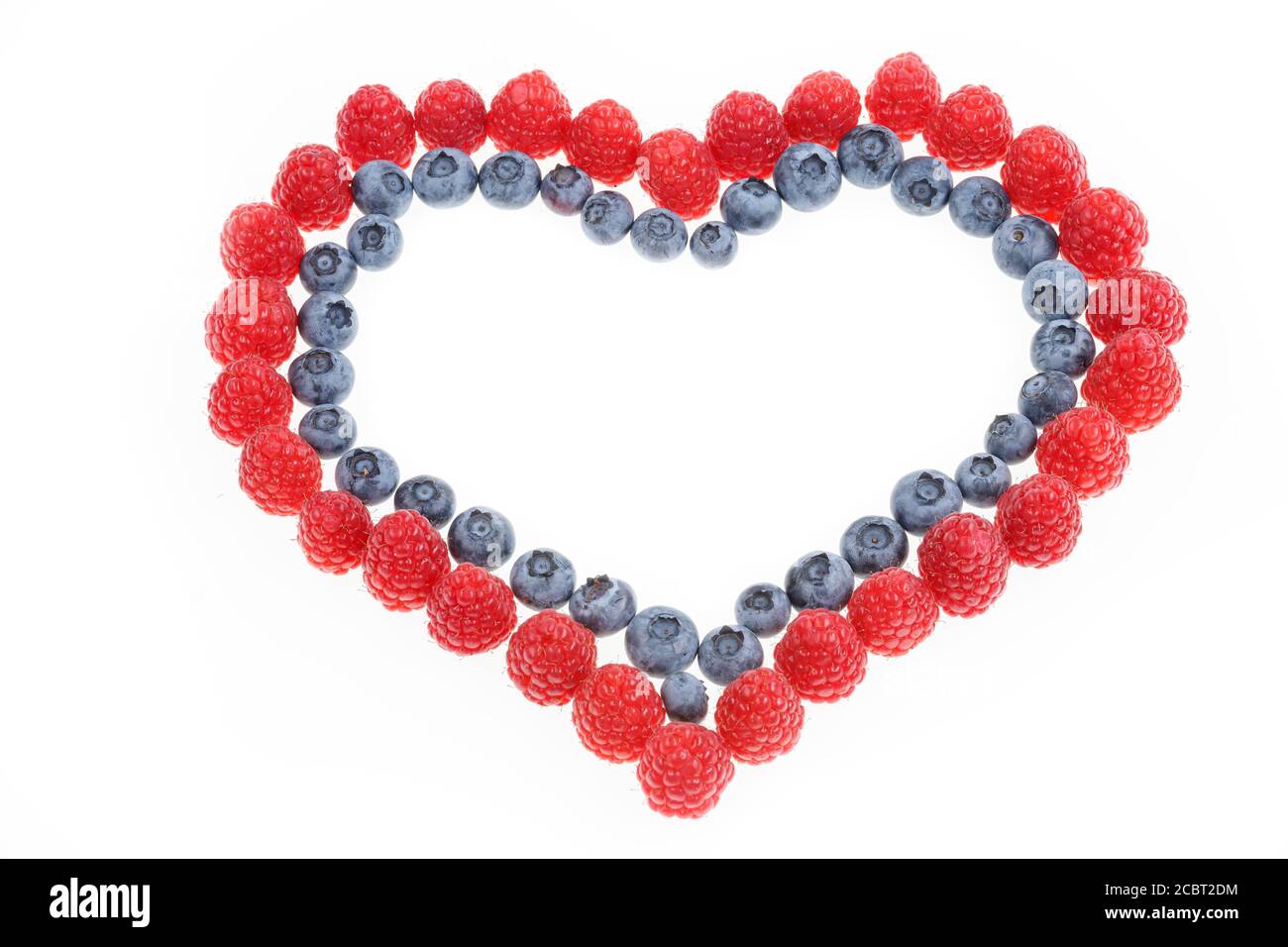 Heart from blueberries and raspberries Stock Photo - Alamy