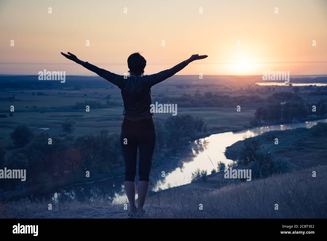 Meditation in sunrise summer field. Relax health concept Stock Photo ...