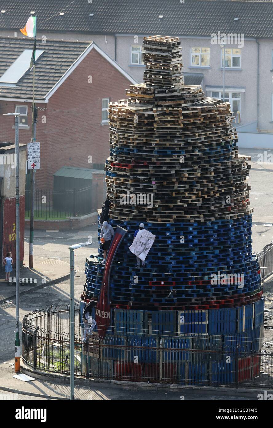 An image of Queen Elizabeth II is added to a bonfire in the Bogside ...