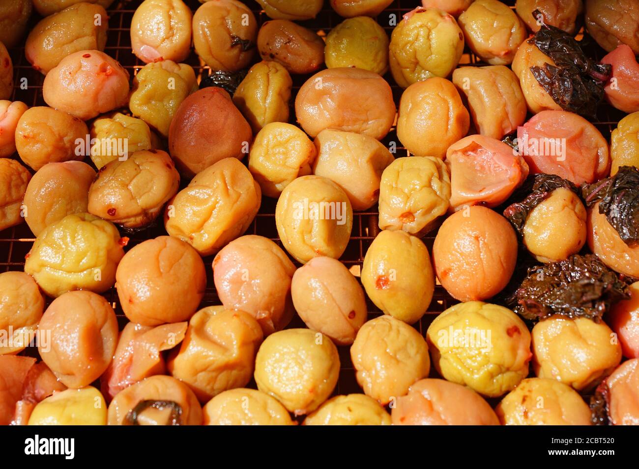 Pink umeboshi pickled ume plums with shiso homemade in summer Stock ...