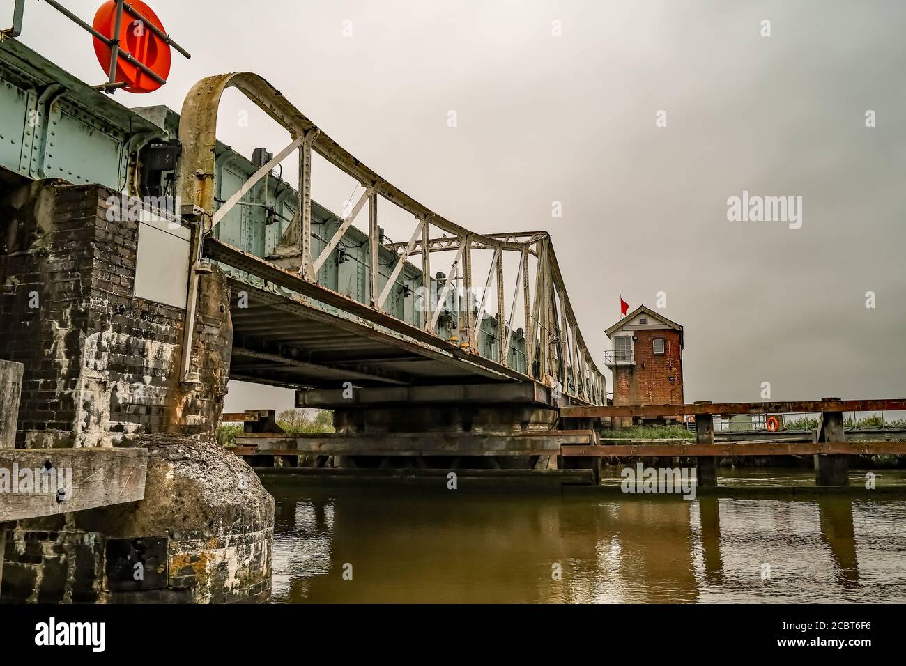 A side on view of the Victorian era metal swing bridge over the River ...