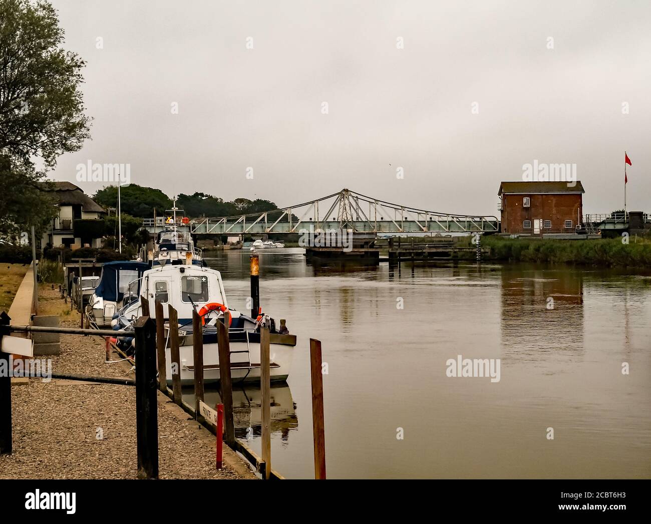 A view down the River Yare towards the metal swing bridge in the ...
