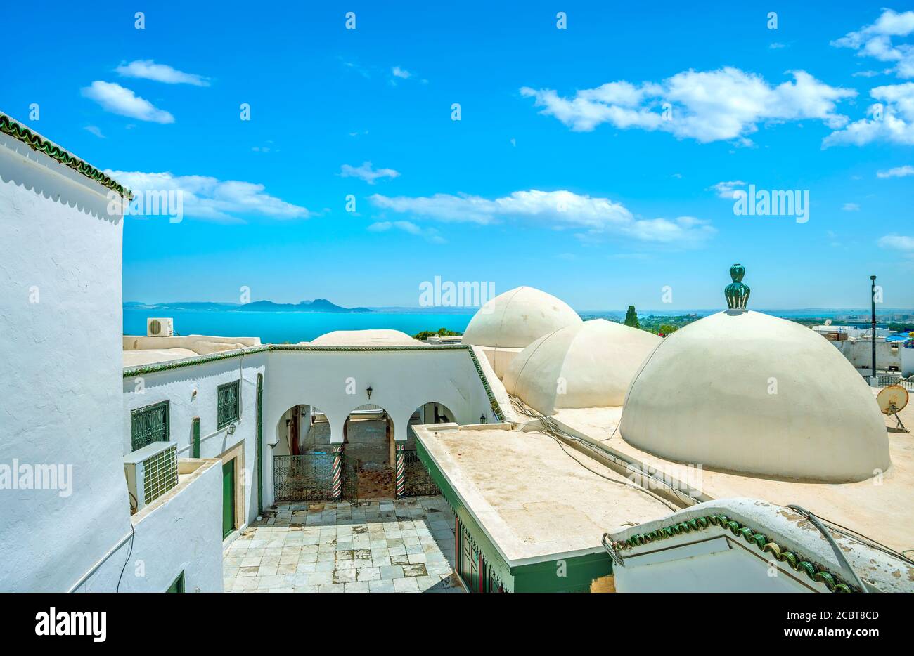 Landscape with traditional architecture and view of seaside in white ...