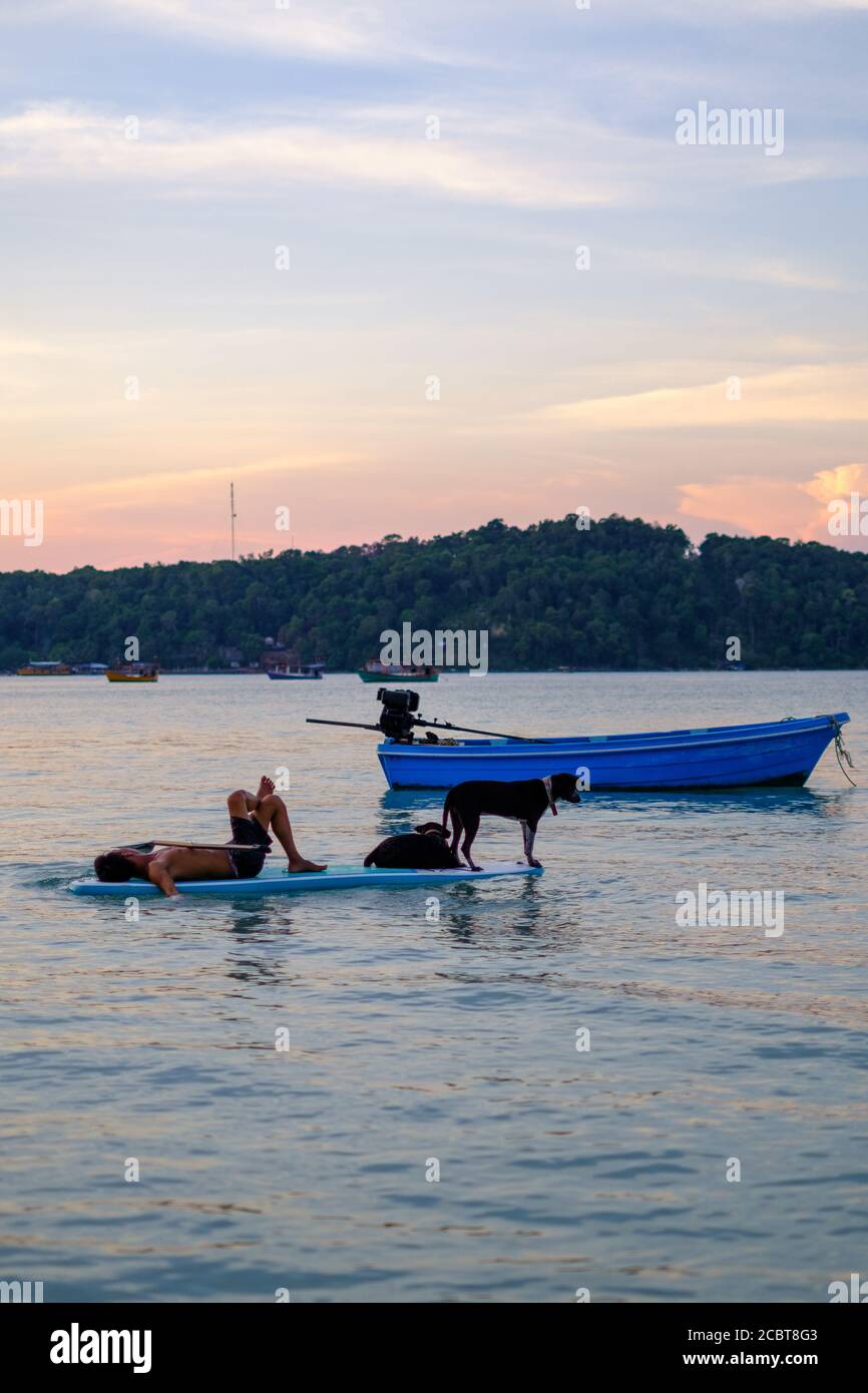 Koh Rong Samloem island, Cambodia - April 21 2019: Young guy relaxing ...
