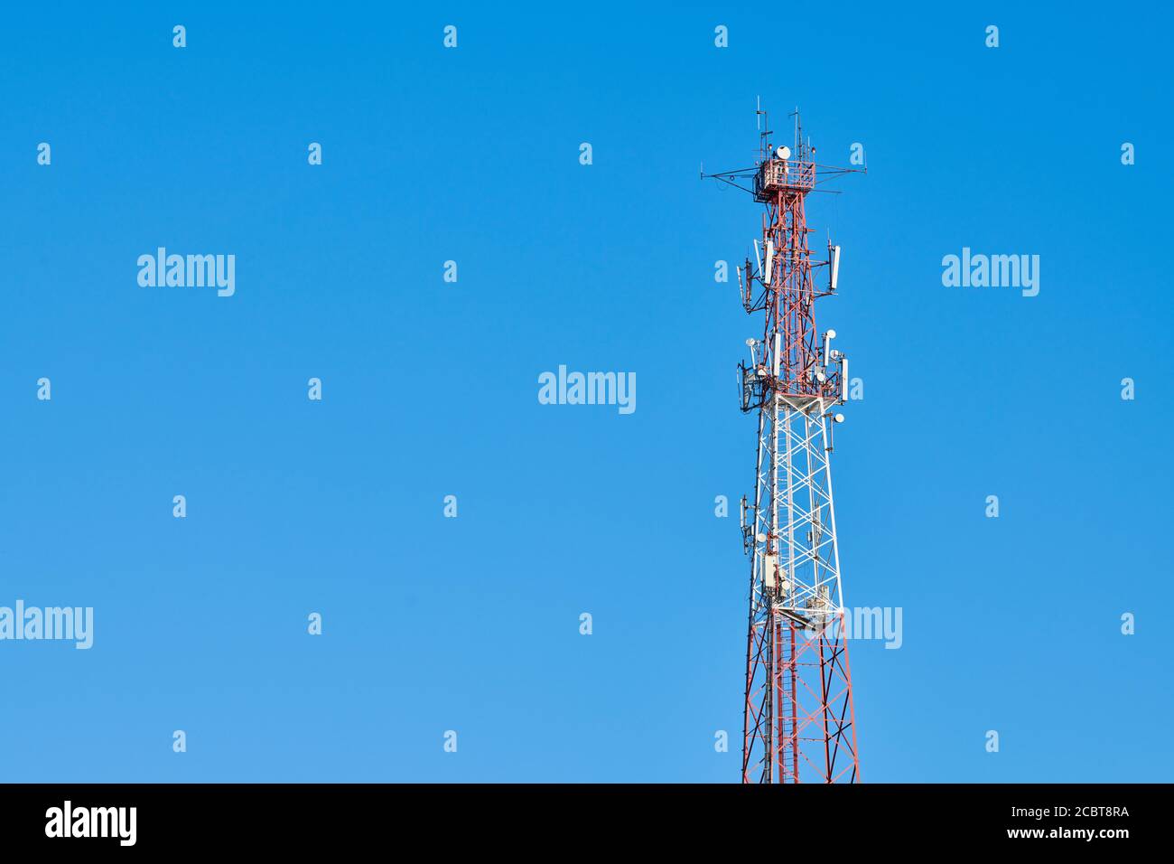 5G TV radio tower, copy space. 5G tower with parabolic antenna and ...