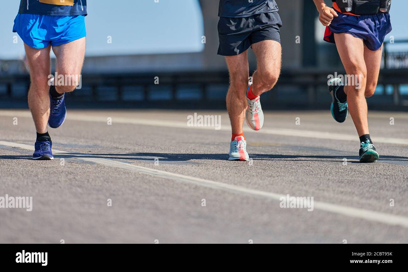 Running men. Sport men jogging in sportswear on city road. Healthy ...