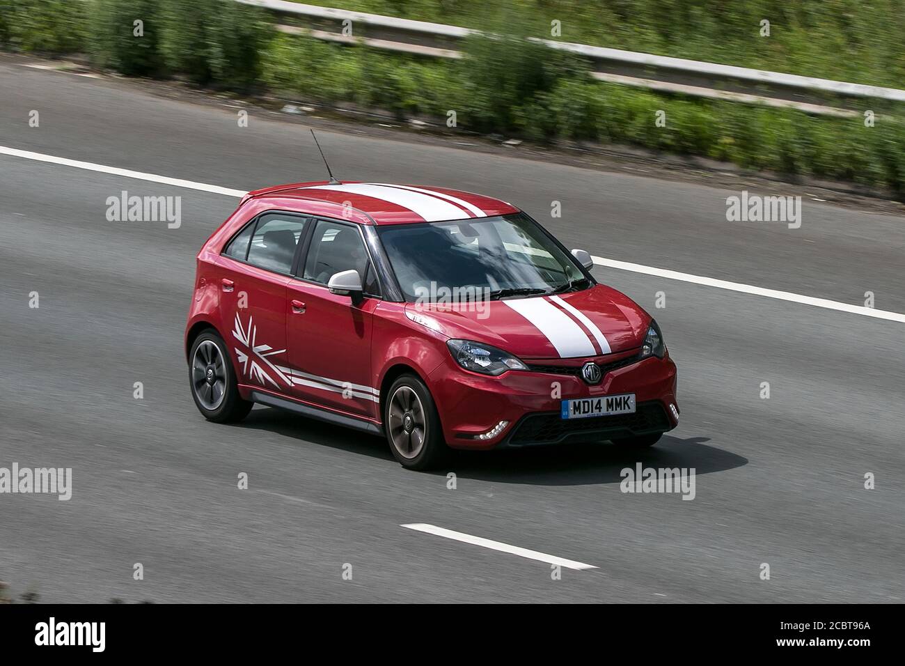 2014 red MG 3 Style Vti-Tech driving on the M6 motorway near Preston in ...