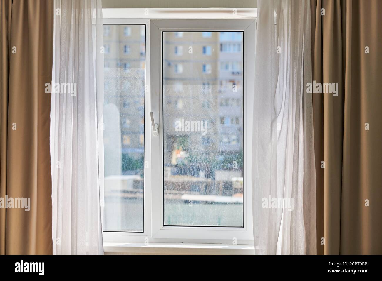 Dirty window in apartment. Unwashed dusty glass, city street view ...