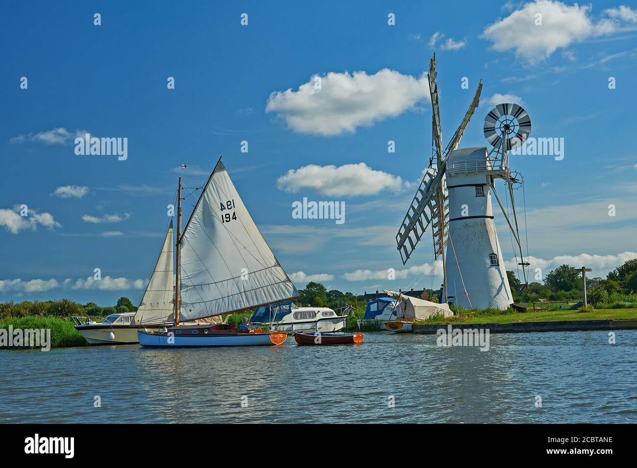 Thurne windmill and boats on the River Thurne, Norfolk Broads, Norfolk ...