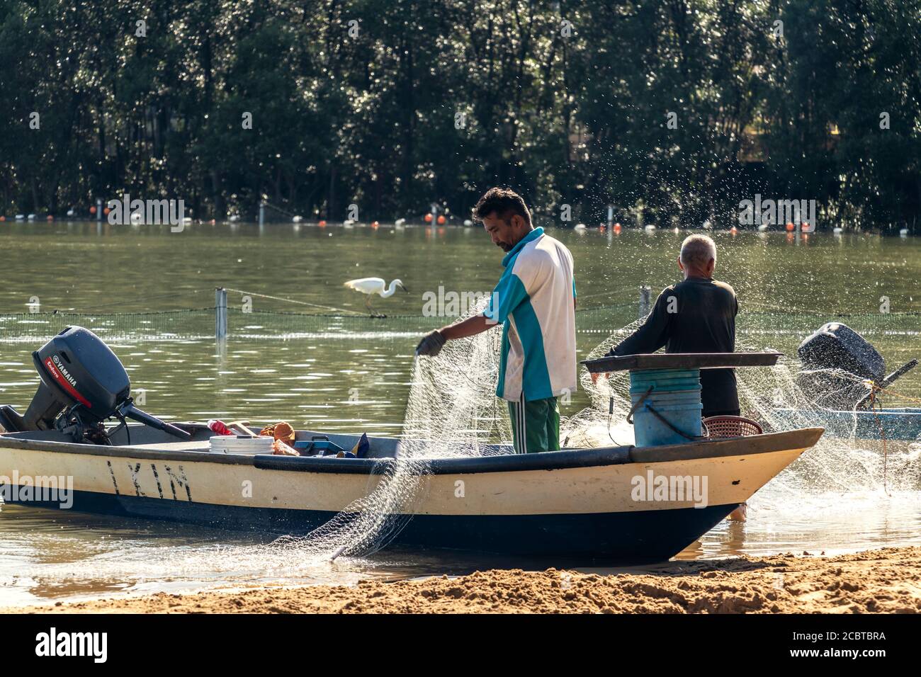 Fishing community and local community come together selling fish next ...