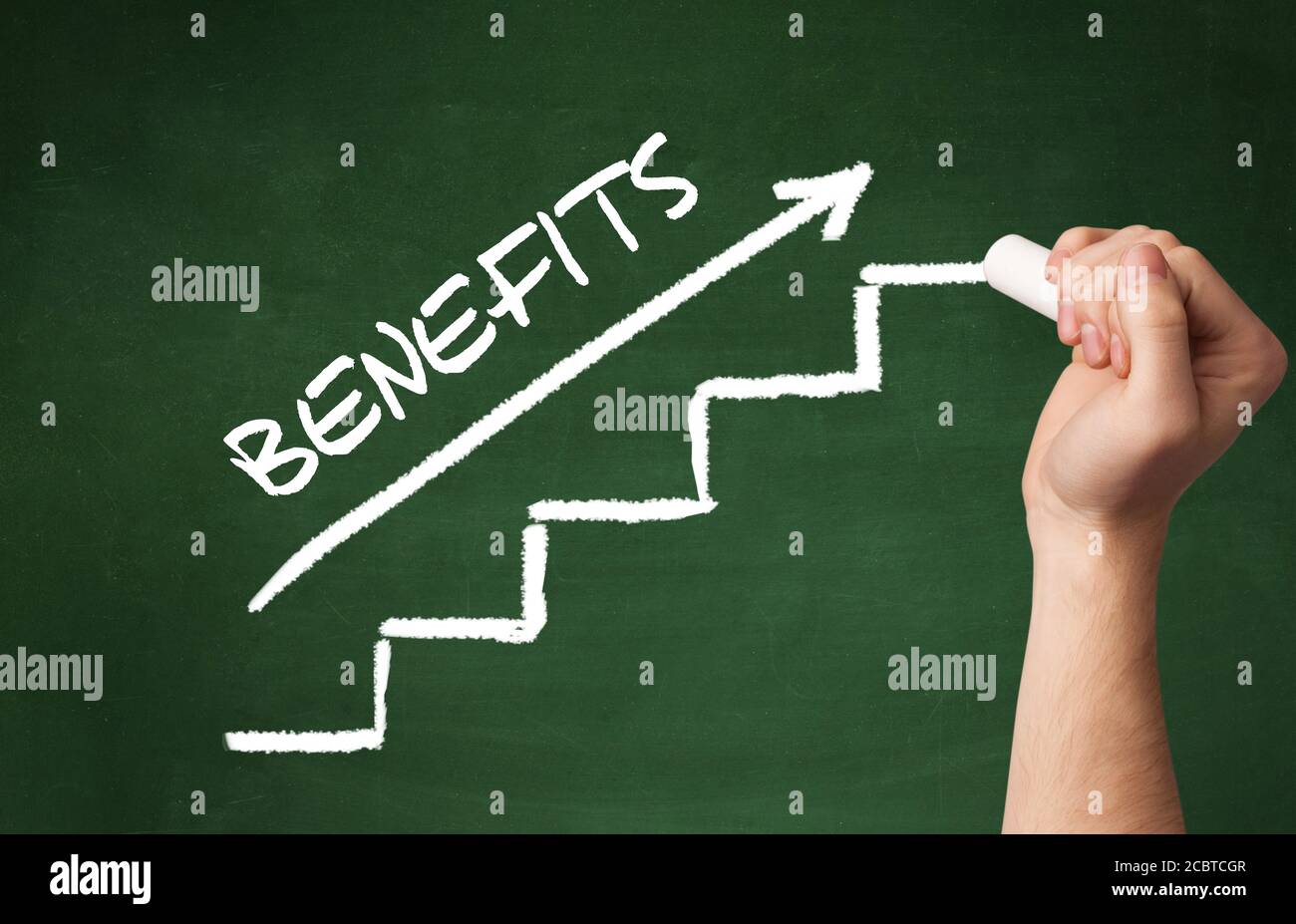 Hand drawing BENEFITS inscription with white chalk on blackboard ...