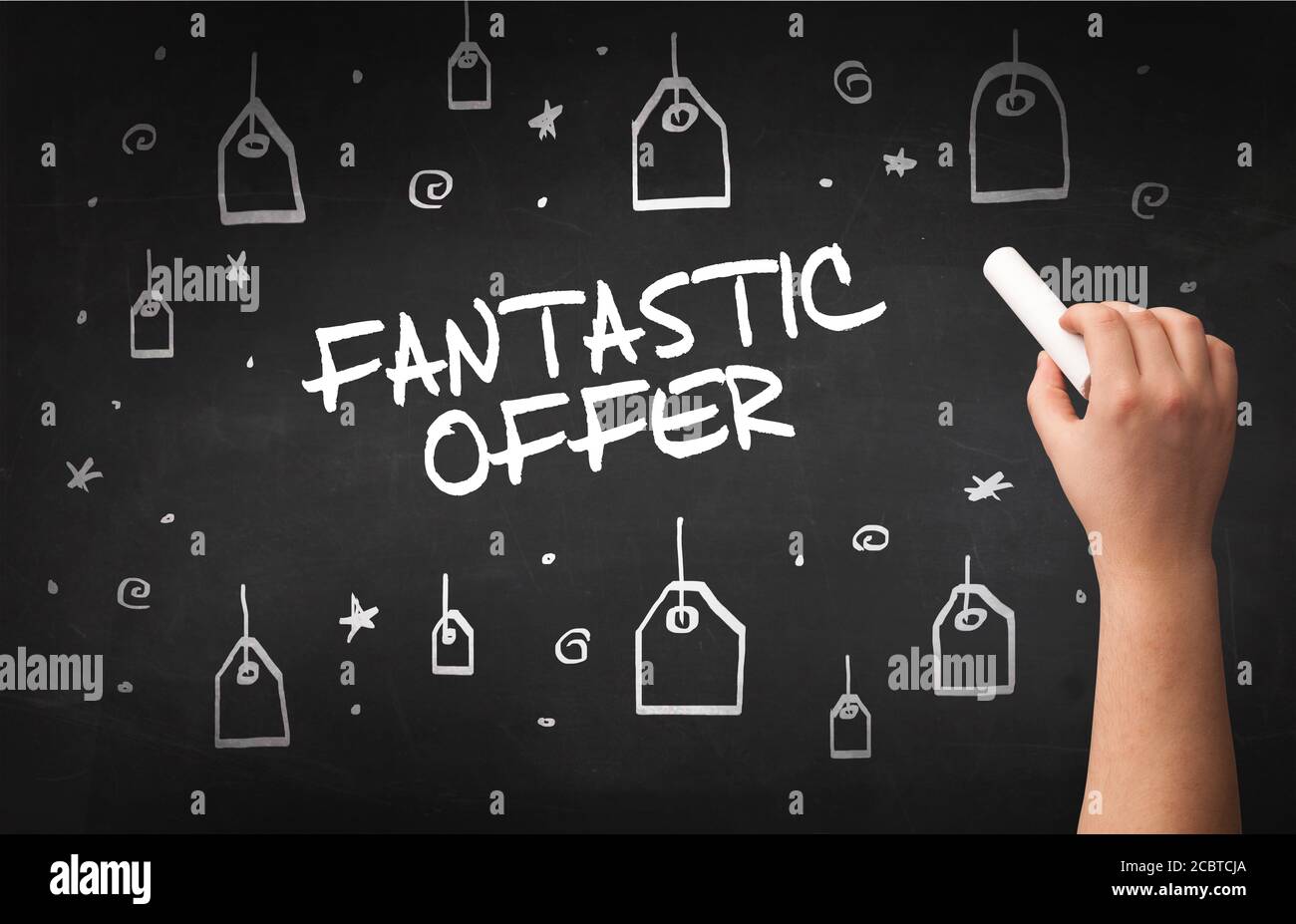 Hand drawing FANTASTIC OFFER inscription with white chalk on blackboard ...