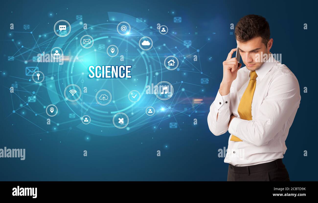 Businessman thinking in front of technology related icons and SCIENCE ...