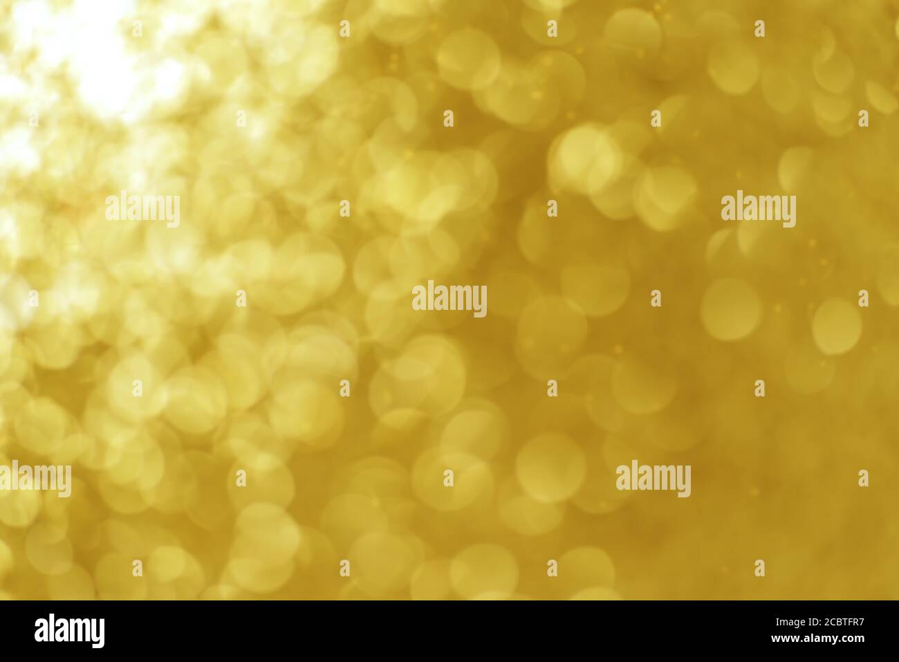 Bright round golden color light bokeh, vivid champagne color background ...