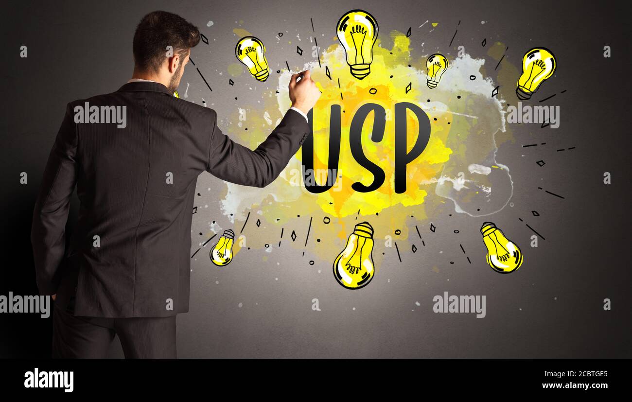 businessman drawing colorful light bulb with USP abbreviation, new ...