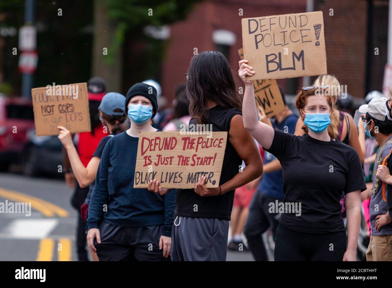 Washington, DC, USA. 15th Aug, 2020. Pictured: Protesters carry signs ...