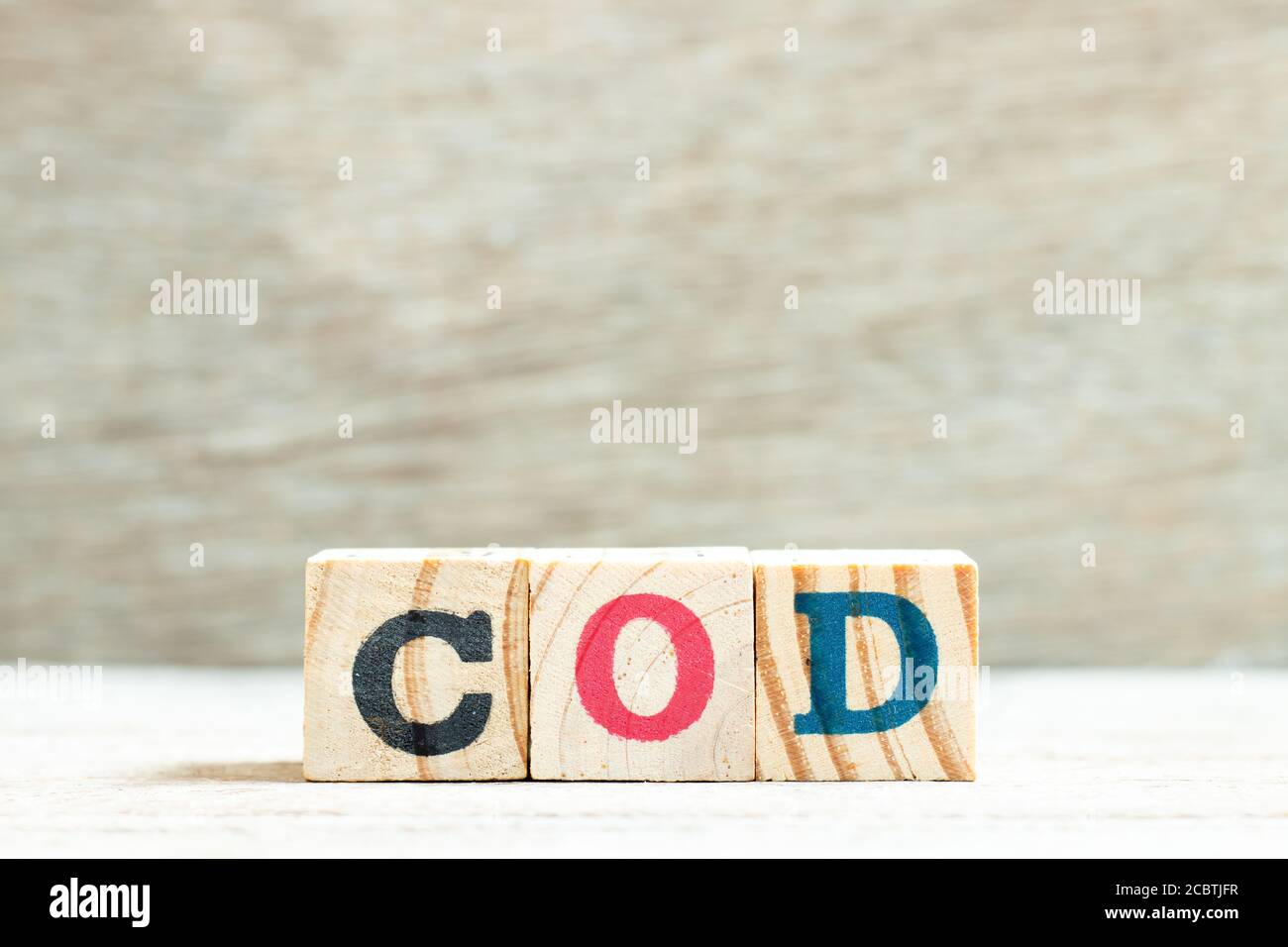 Alphabet letter in word COD (Abbreviation of cash on delivery) on wood ...