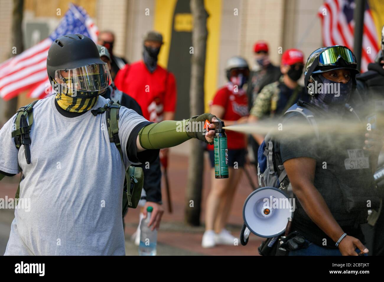Portland, USA. 15th Aug, 2020. One of the Proud Boy adherents pepper ...