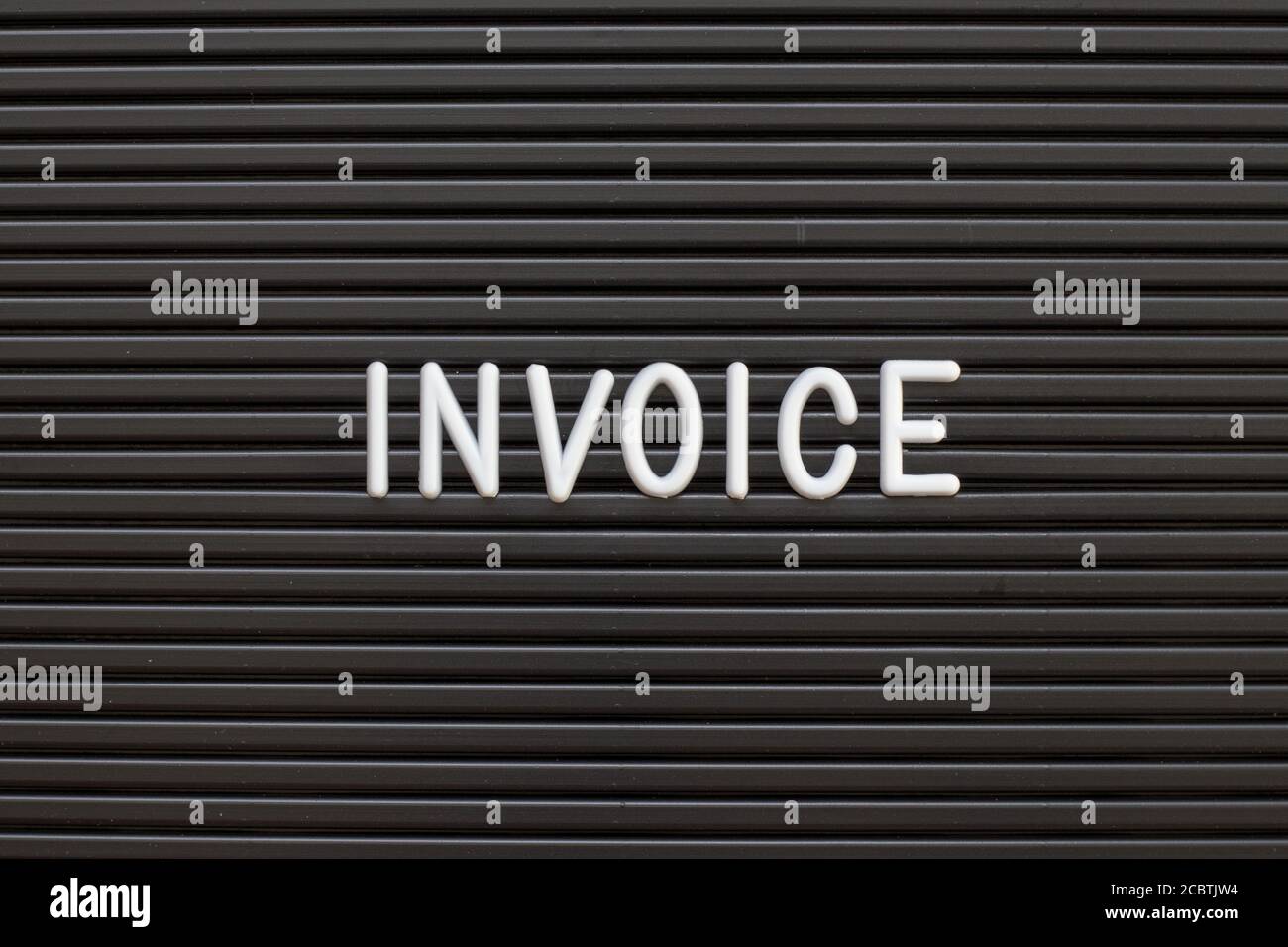Black color felt letter board with white alphabet in word invoice ...