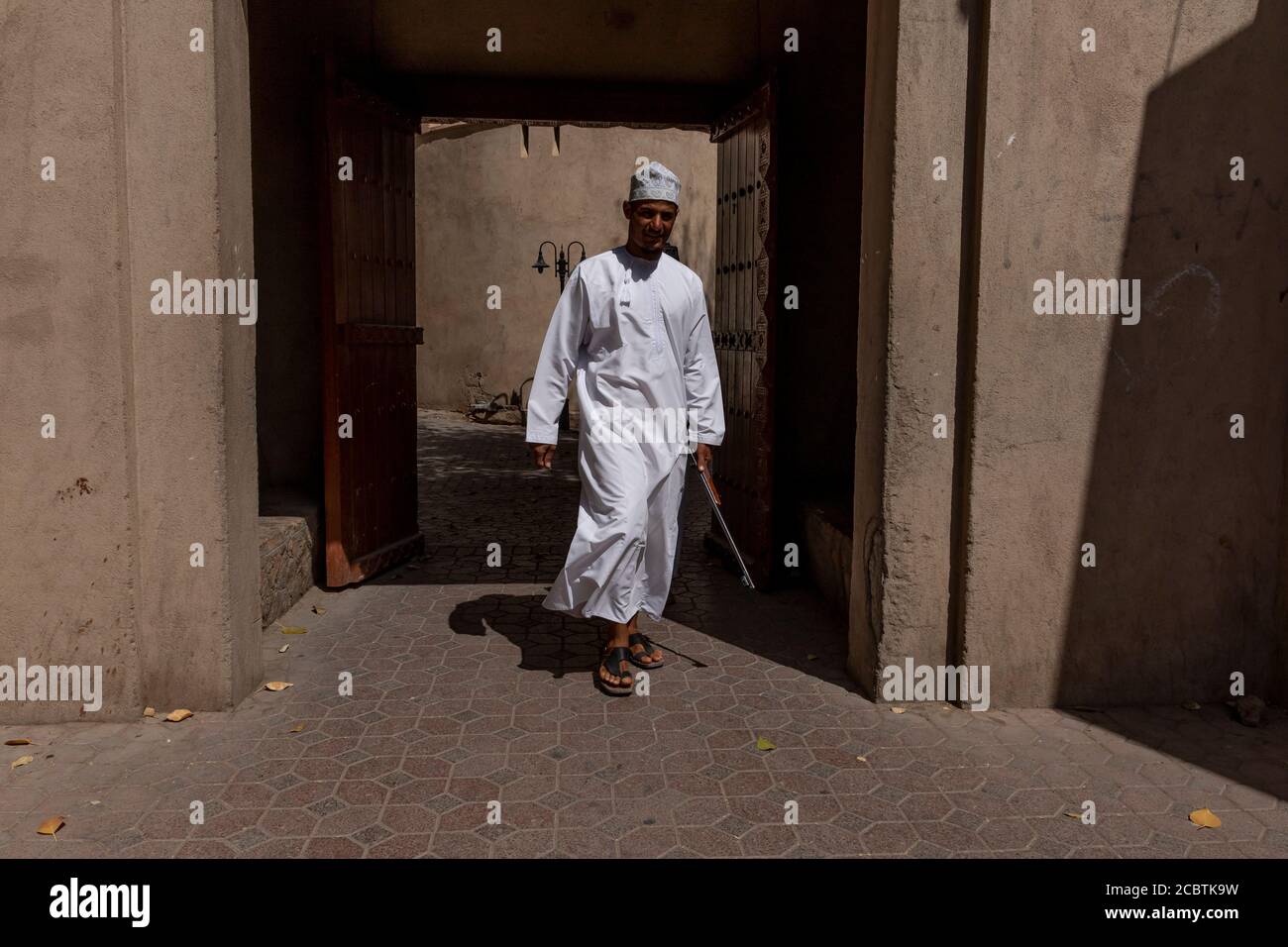 Omani man walking hi-res stock photography and images - Alamy