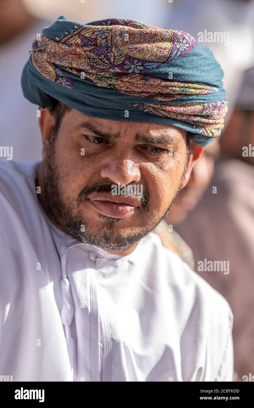 portrait of omani merchant attending the goat auction Stock Photo - Alamy