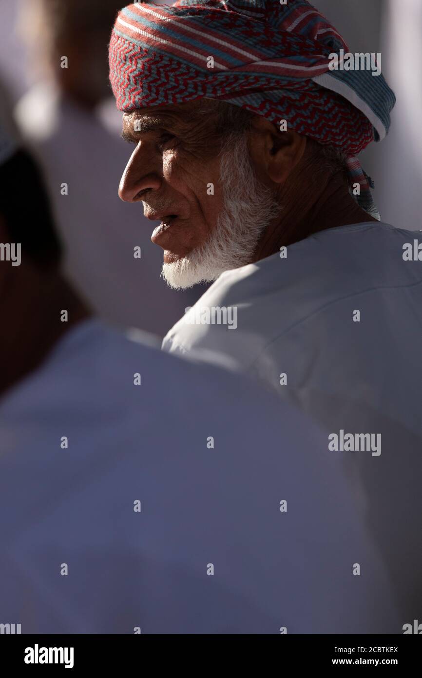 portrait of omani merchant attending the goat auction Stock Photo - Alamy