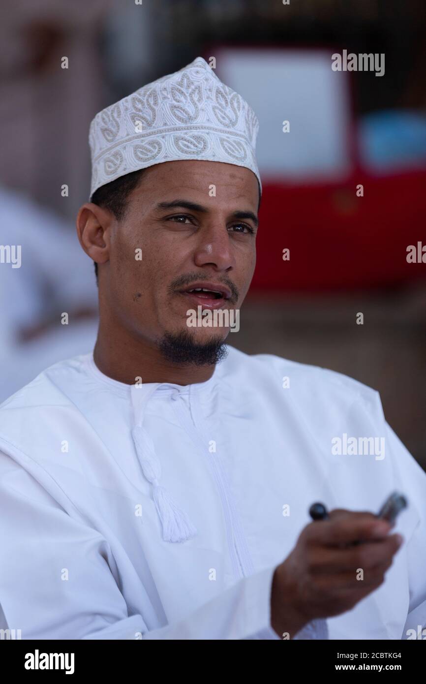 portrait of omani merchant attending the goat auction Stock Photo - Alamy