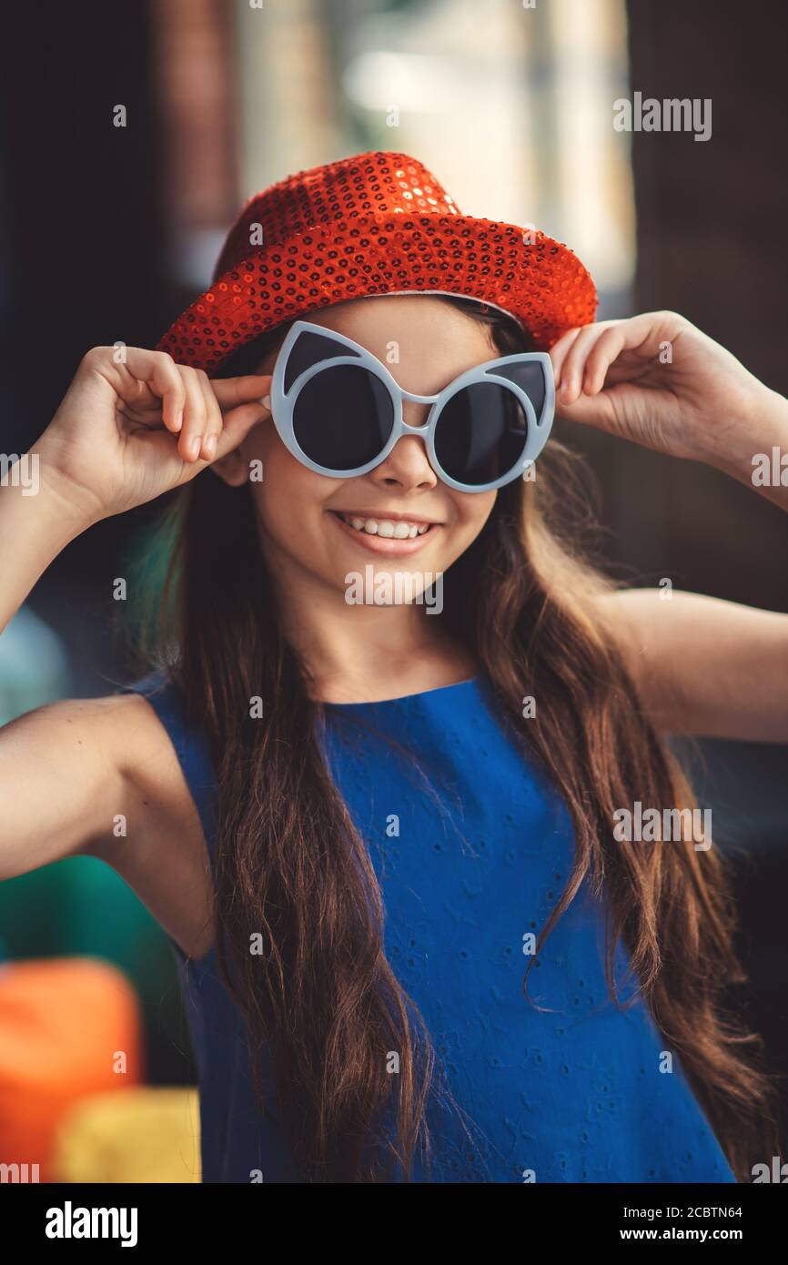 Pretty girl in eyeglasses posing for the photo Stock Photo - Alamy