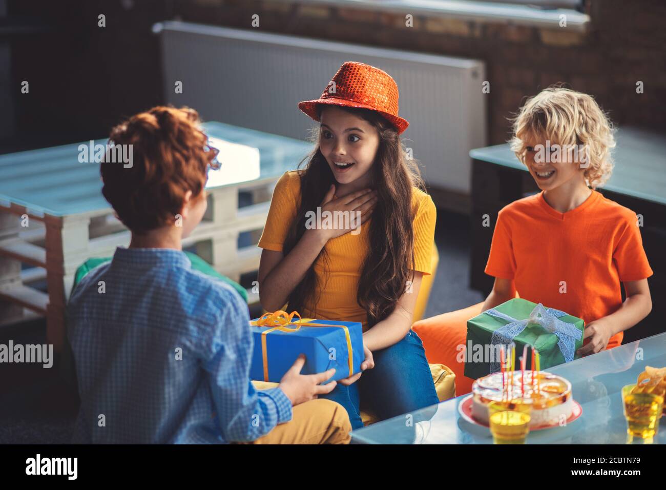 Children receiving gifts hi-res stock photography and images - Alamy