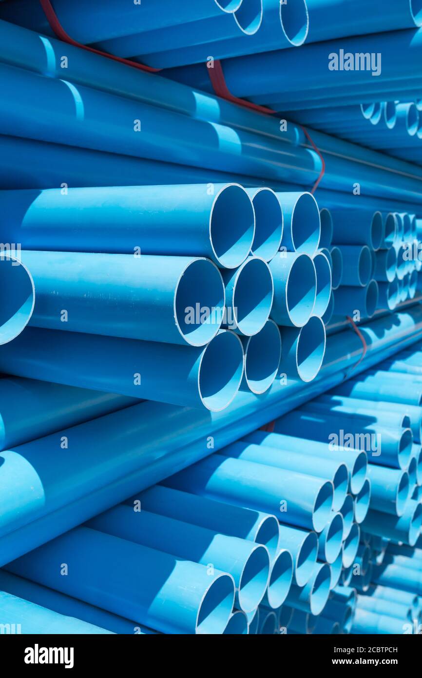 PVC pipes stacked in warehouse Stock Photo - Alamy